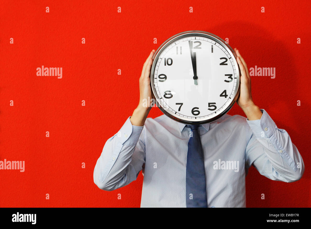 Man with clock hi-res stock photography and images - Alamy