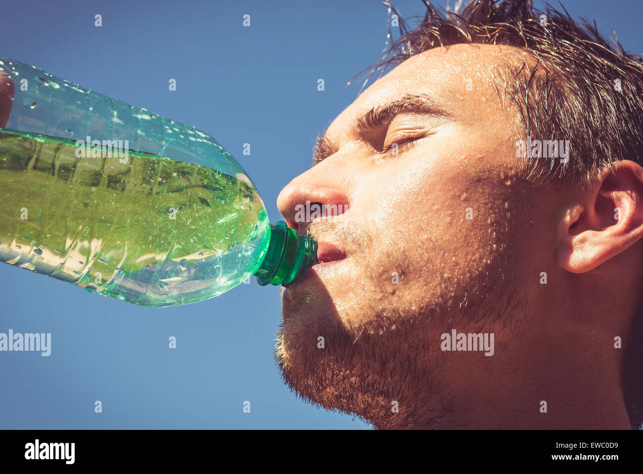 Photo of a man who's face is covered with water. Beautiful sky in the ...