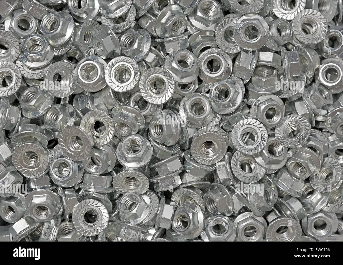 Pile of shiny chrome nuts. Background, texture Stock Photo - Alamy