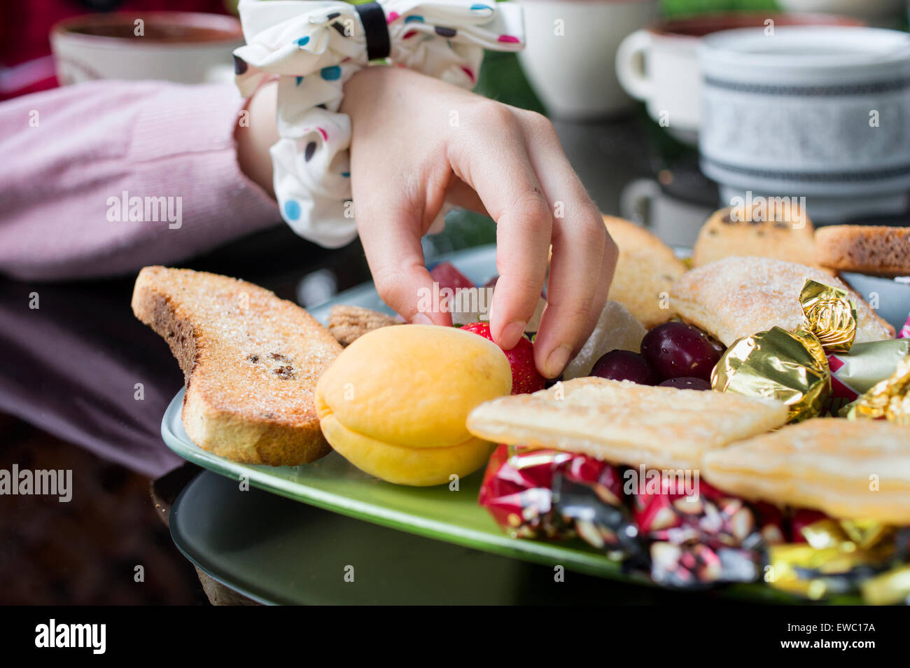 Hand Picking Sweets Stock Photo - Alamy