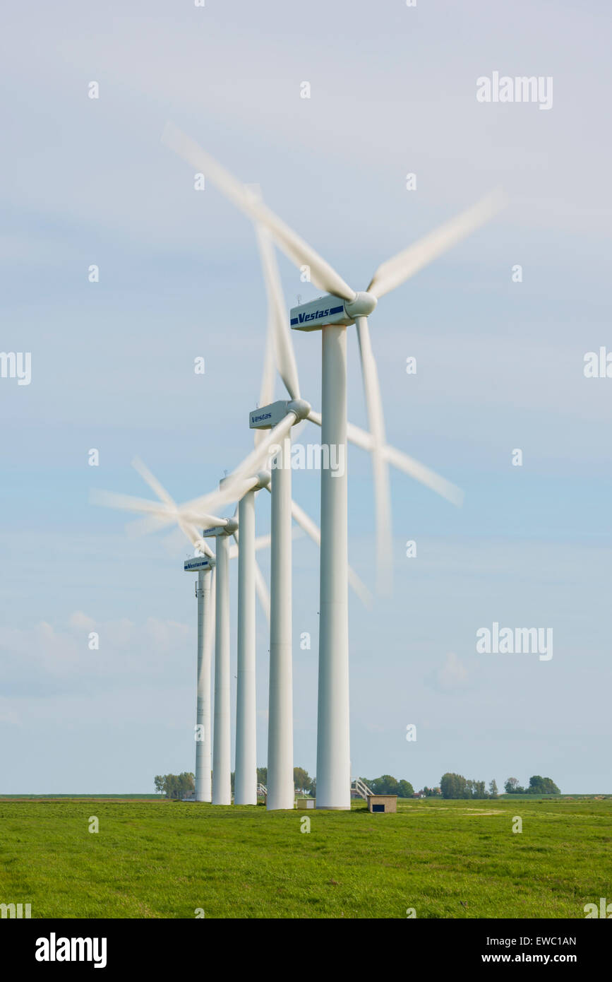 Modern windmills at the horizon in province Friesland near Idsegahuizum ...