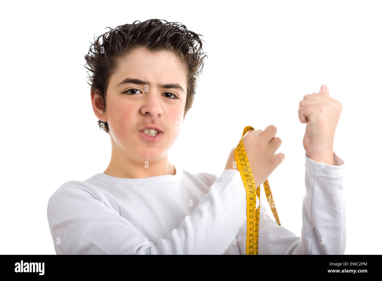 Caucasian smooth-skinned boy in white long sleeved t-shirt shows teeth ...