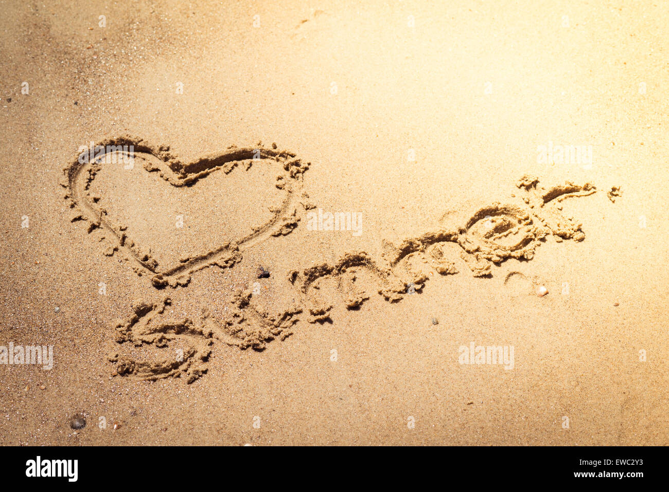text an drawing on the beach in the sand Stock Photo - Alamy