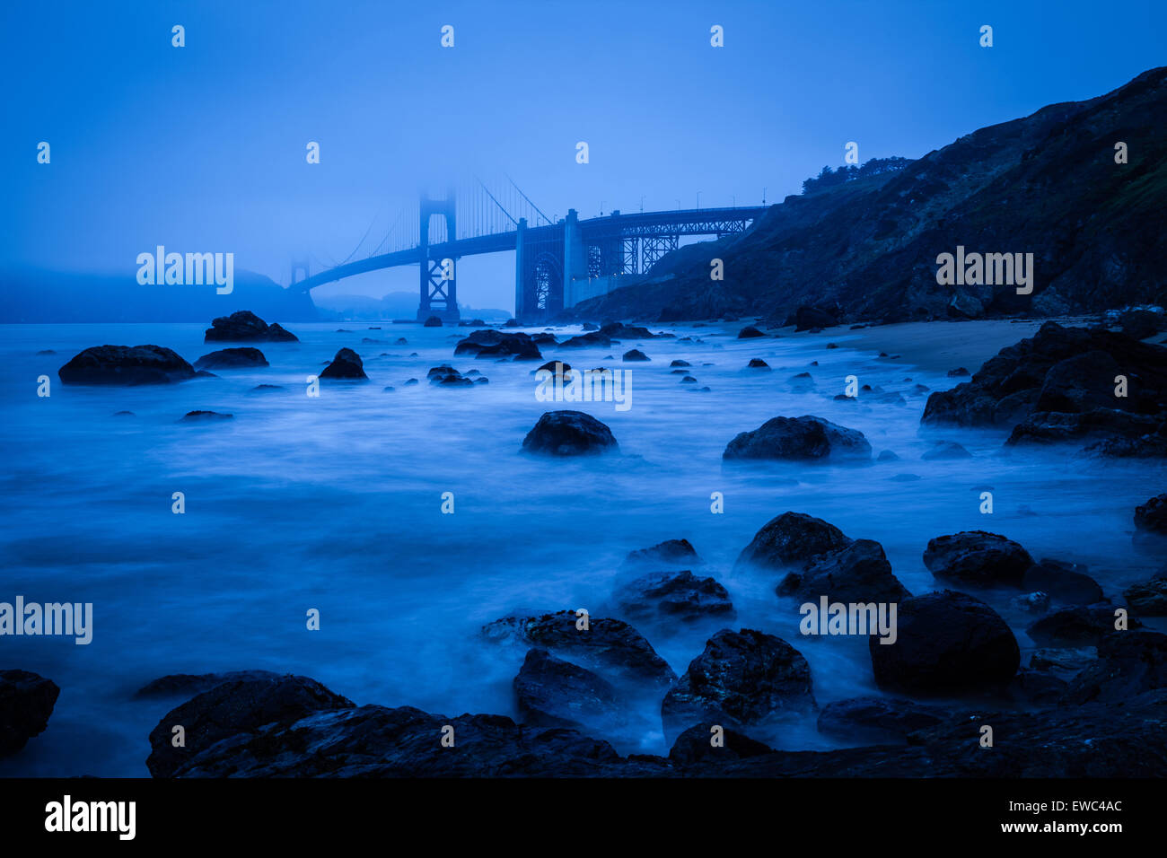 Golden Gate Bridge San Francisco in the fog and mist at dawn from Baker ...