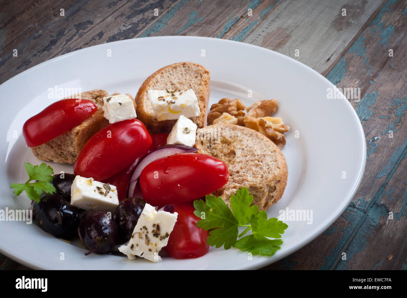 Traditional Greek, Cretan, barley rusk bread accompanied by fresh ...