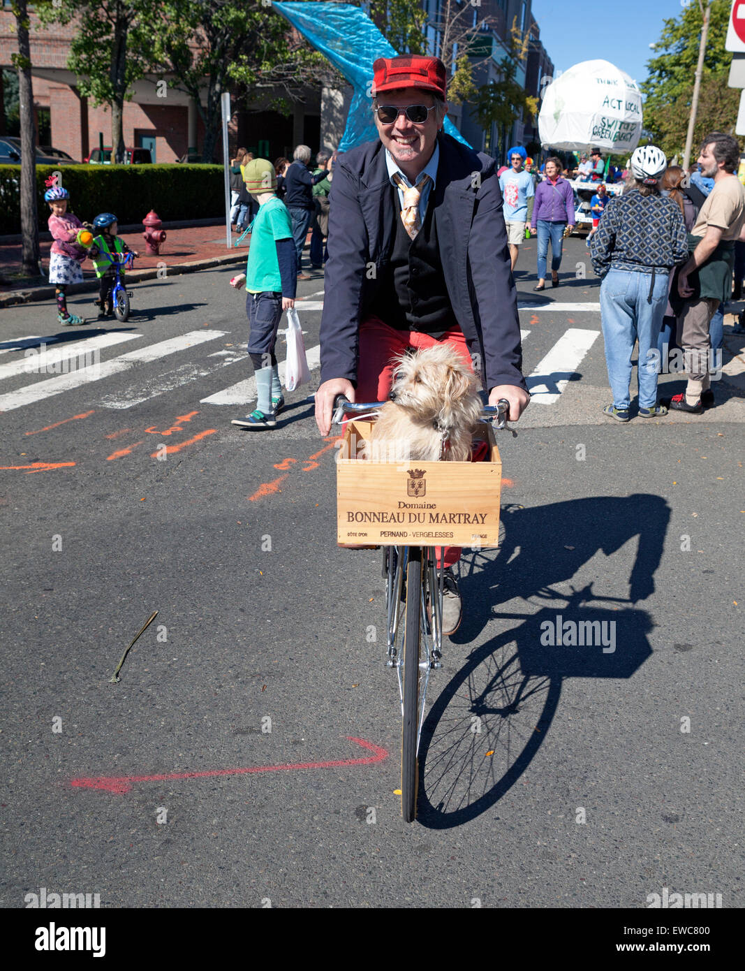 A man rides his bike with his dog in a wooden crate at the Honk ...