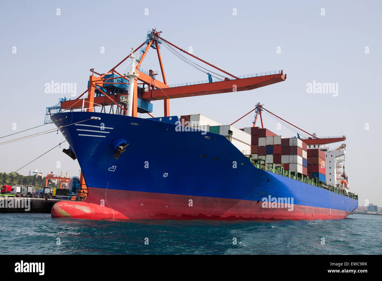 Container Ship is loading in a port Stock Photo - Alamy
