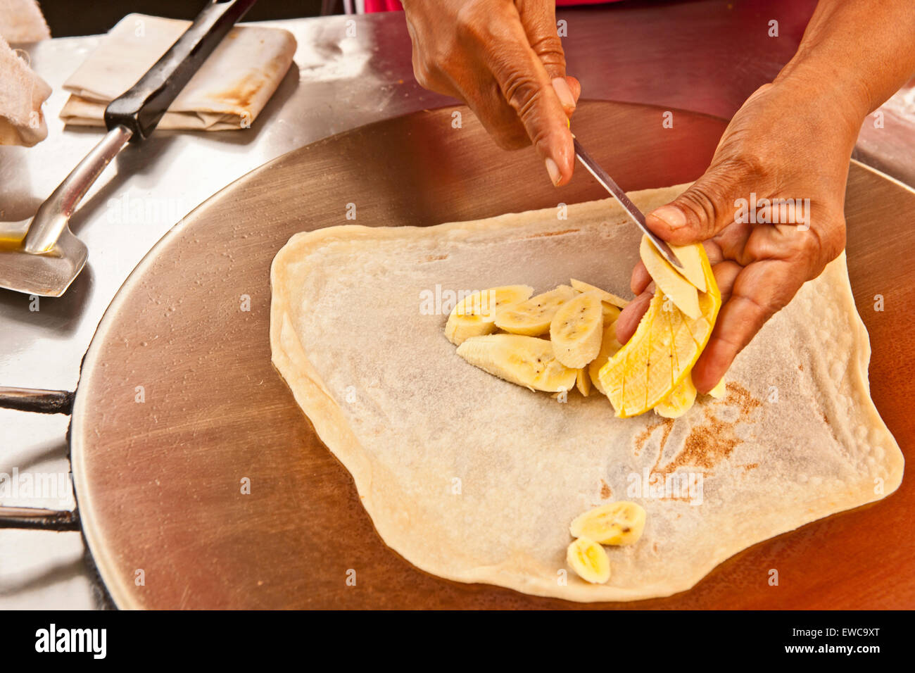 Traditional Thai pancake "Roti" in the making at a street vendor in ...