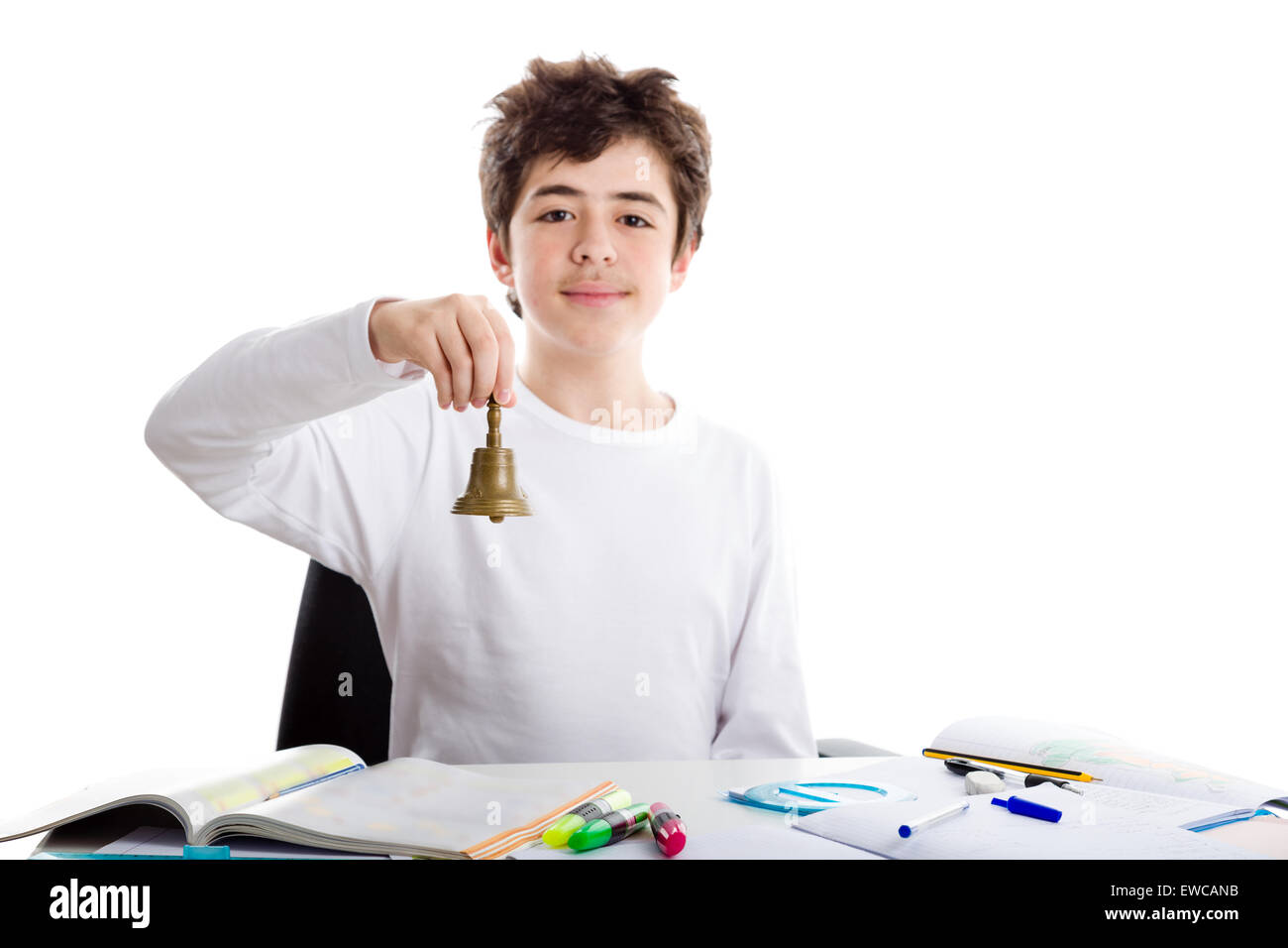 Caucasian Teenager boy sitting ringing a small bell with right hand ...