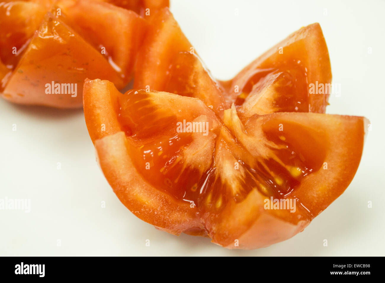 Tomato cross section isolated on white background Stock Photo - Alamy
