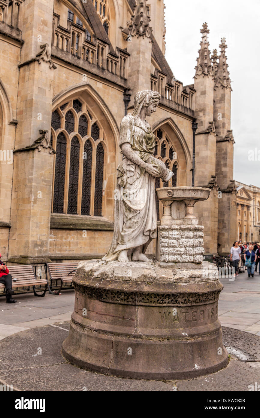 Statue of a woman with a water jug by the fountain near Bath Abbey in ...