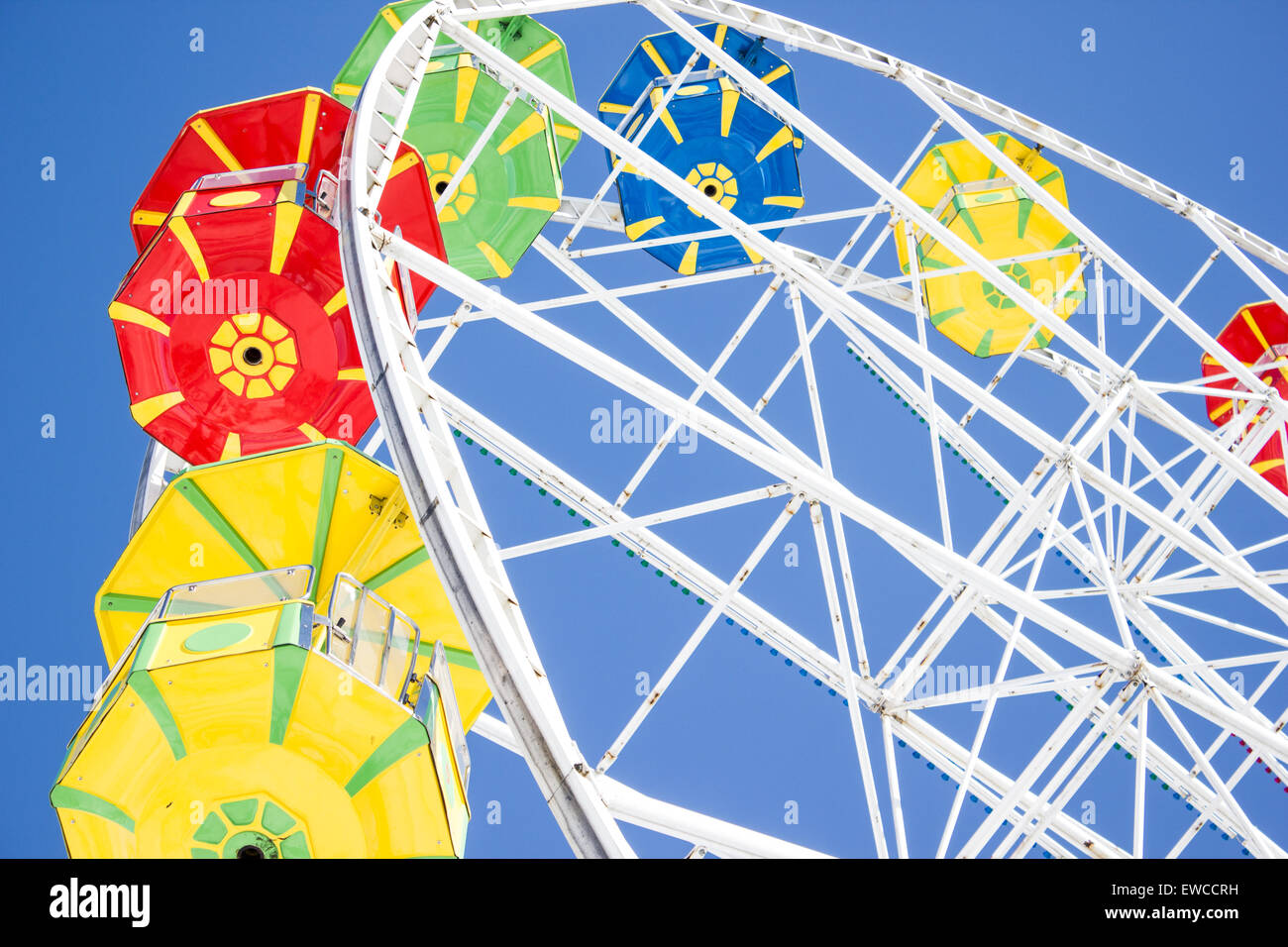 Colorful Ferris wheel against blue summer sky background Stock Photo ...