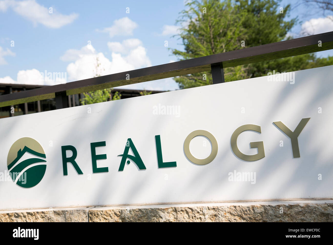 A logo sign outside of the headquarters of Realogy Holdings Corp., in ...