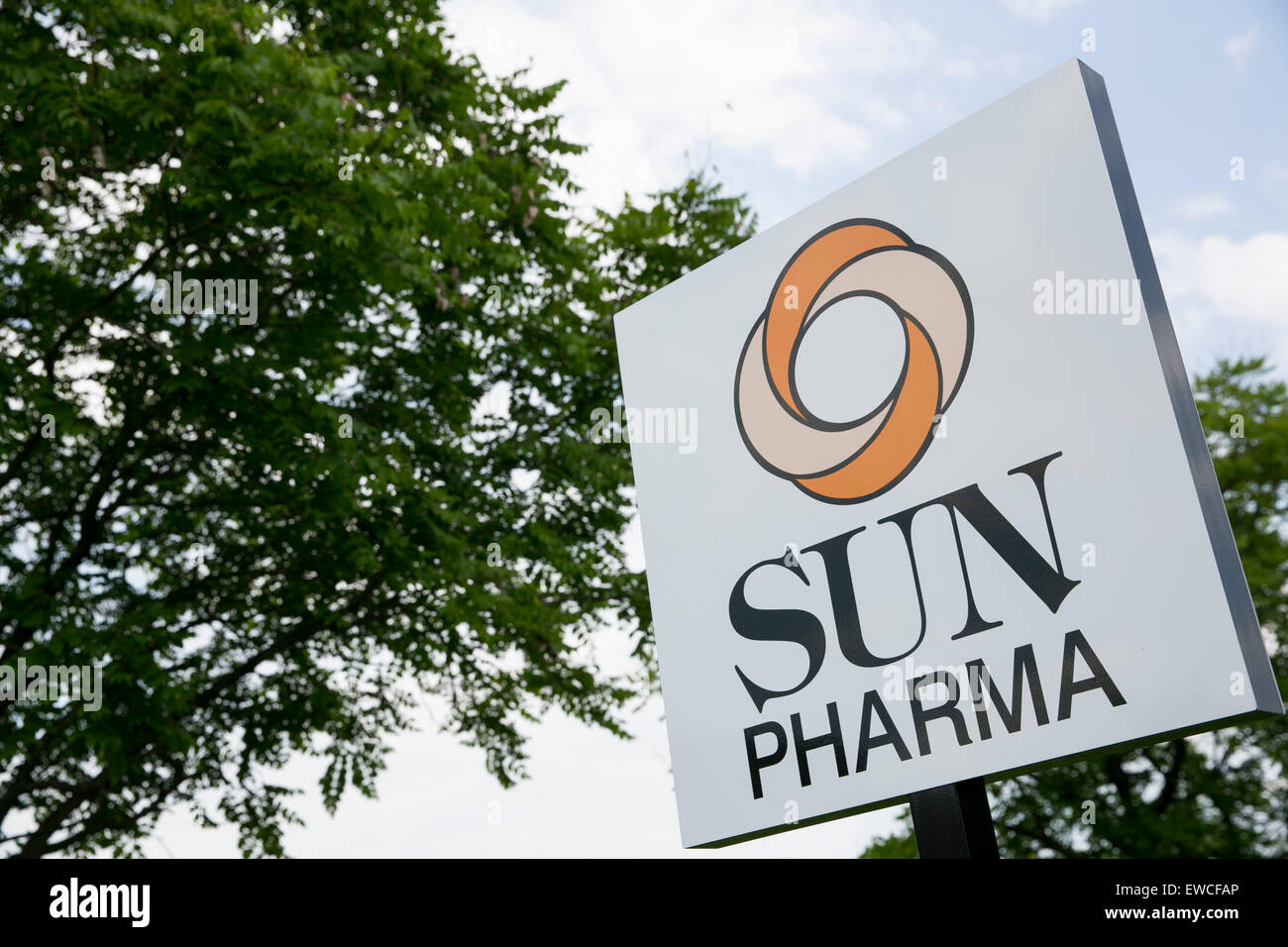 A logo sign outside of a facility occupied by Sun Pharmaceutical ...