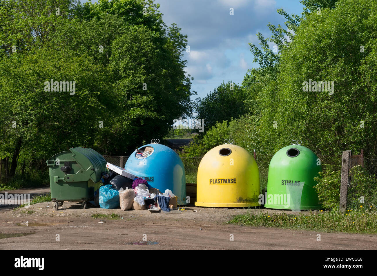 Dump of garbage and garbage containers in the wood landscape. Pollution ...