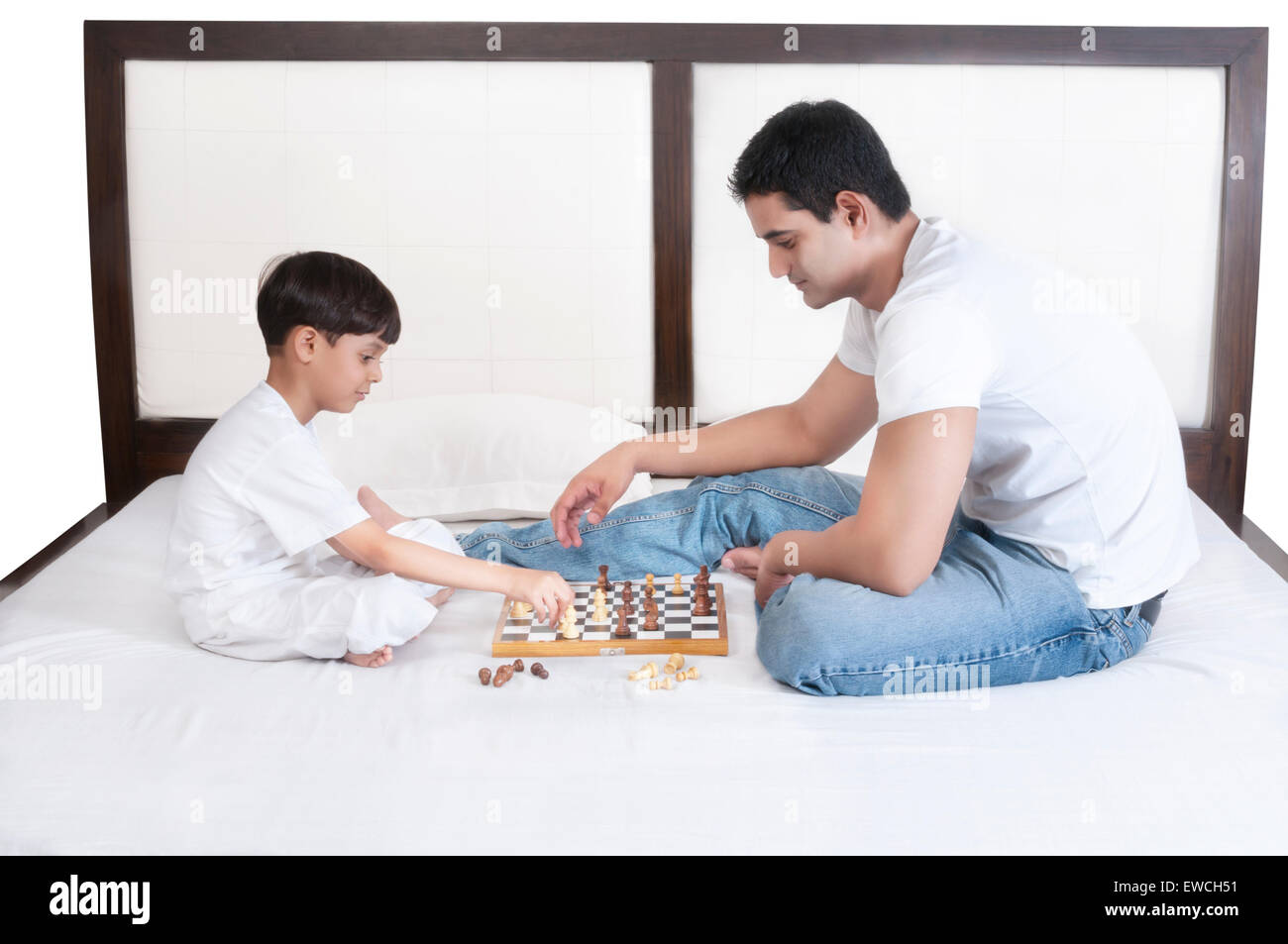 Father and son playing chess Stock Photo - Alamy