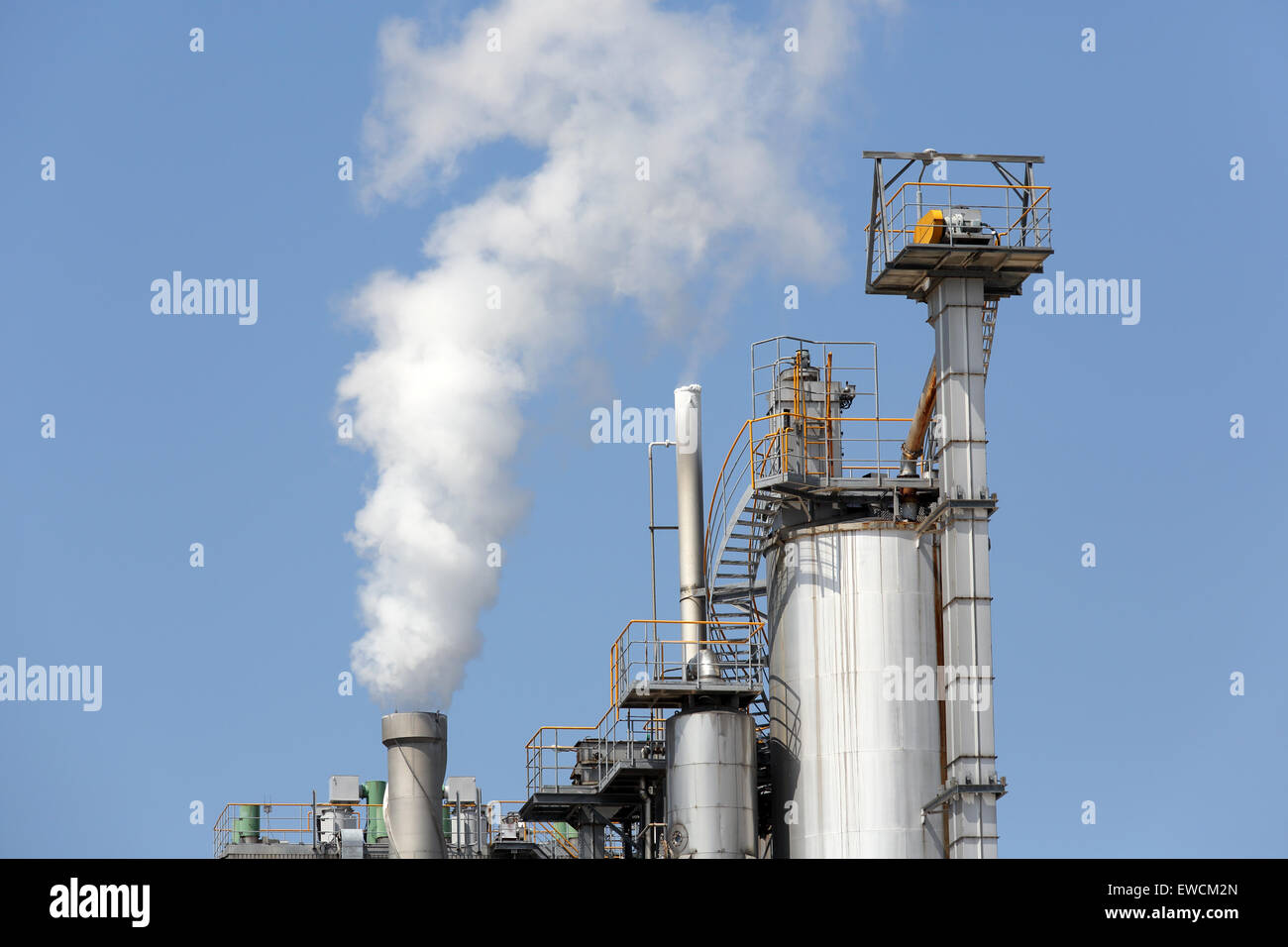 Industrial refinery plant with smoke stack Stock Photo - Alamy
