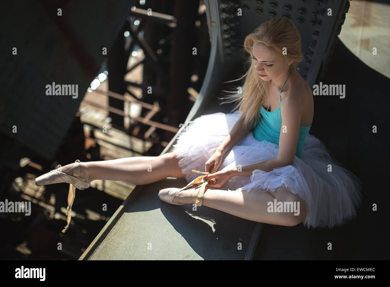 Ballerina sitting on the edge of bridge Stock Photo - Alamy