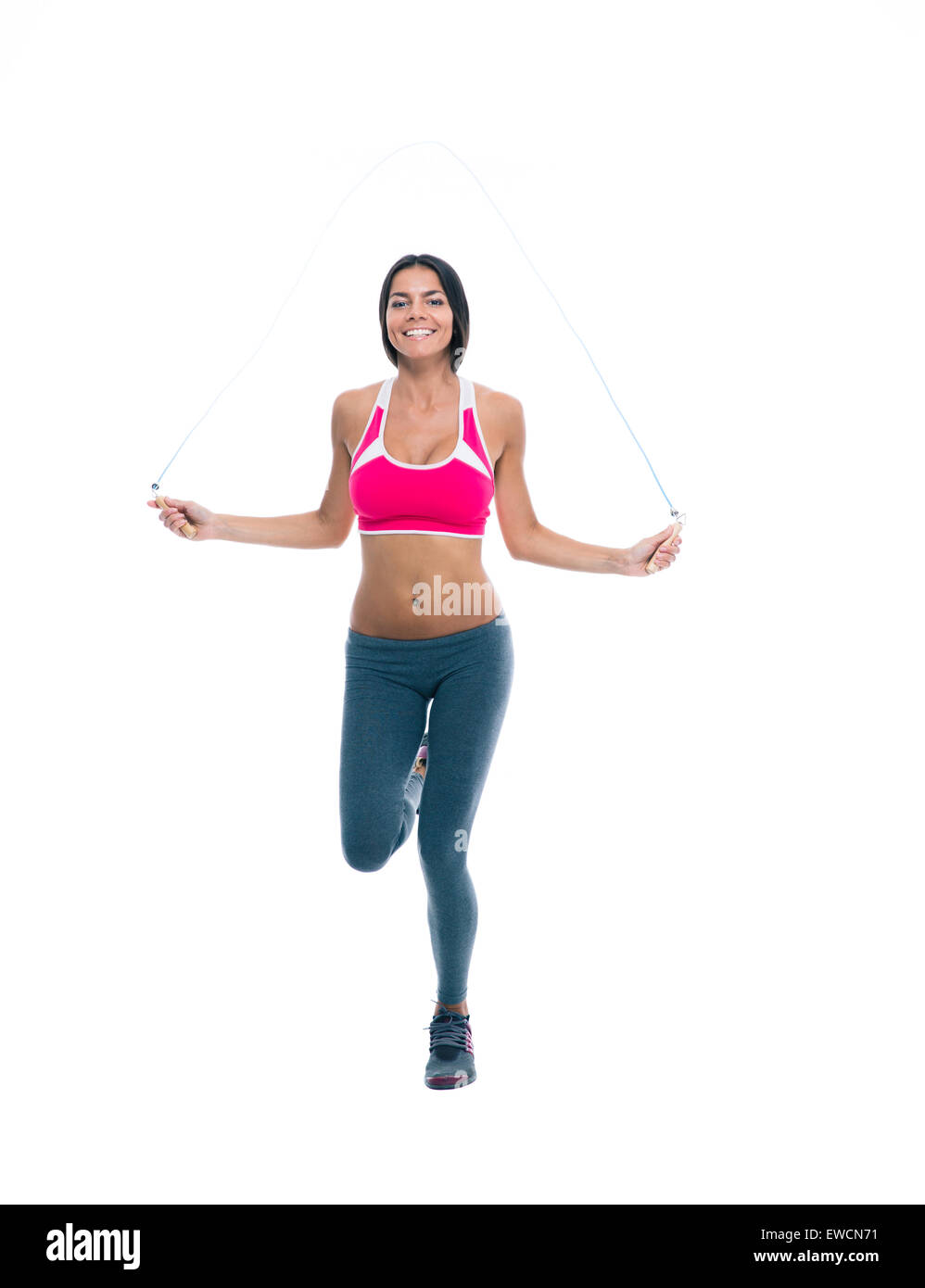 Full length portrait of a sports woman workout with skipping rope ...