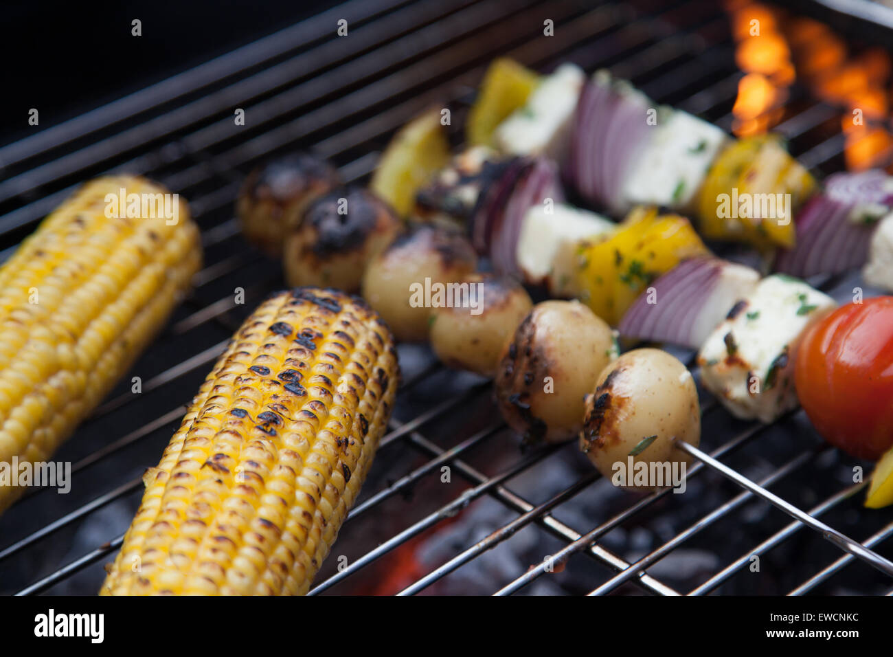 Vegetables grilling on a charcoal fire barbeque Stock Photo - Alamy