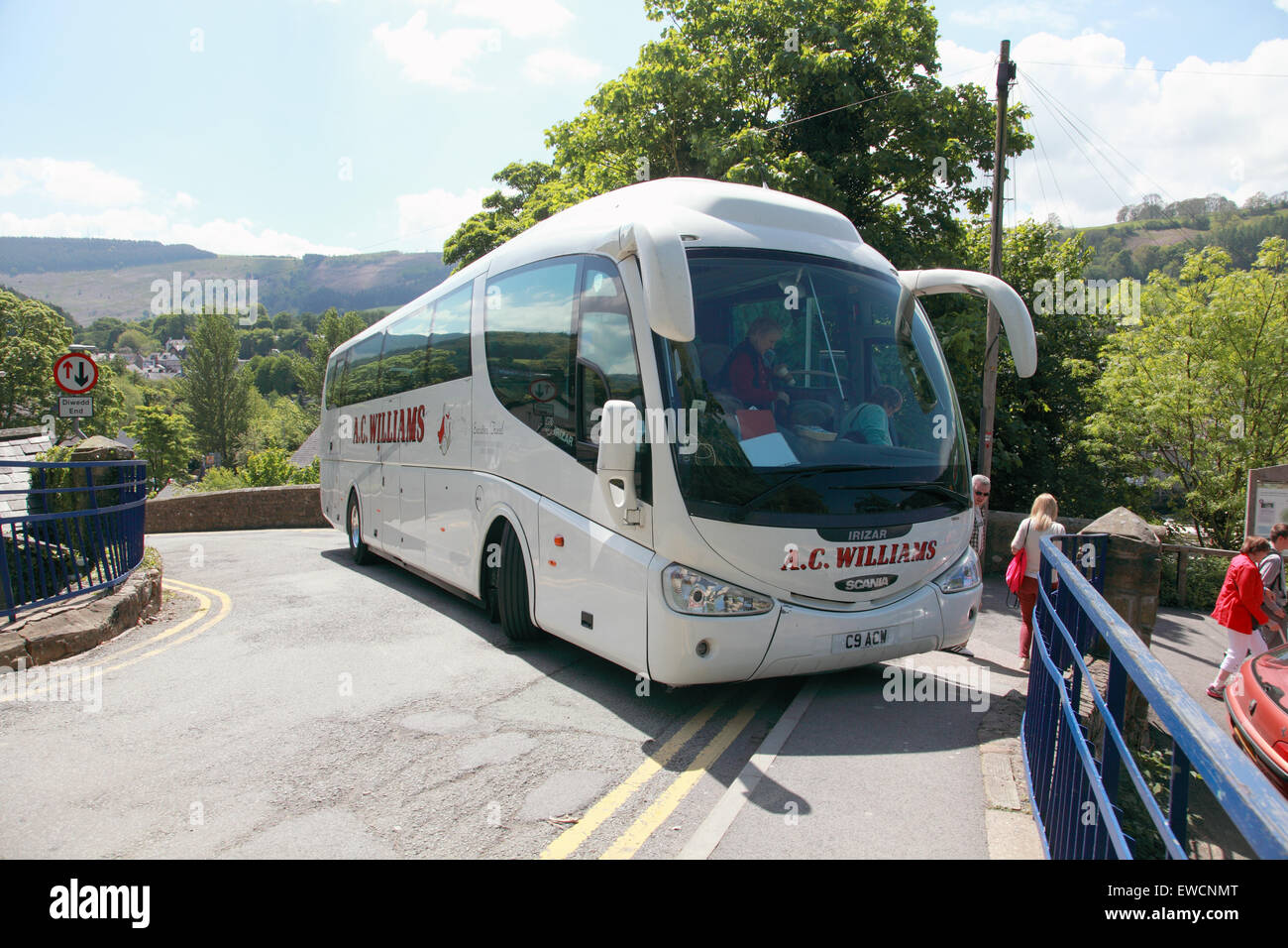 A Scania Irizar PB tour bus dropping off passengers on the steep ...