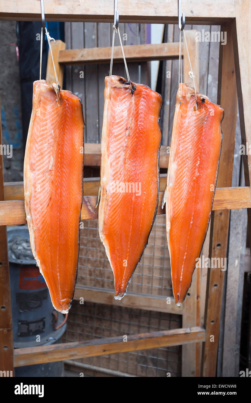 Smoked Salmon Fillets hanging at Maltby Street Food Market Stock Photo ...
