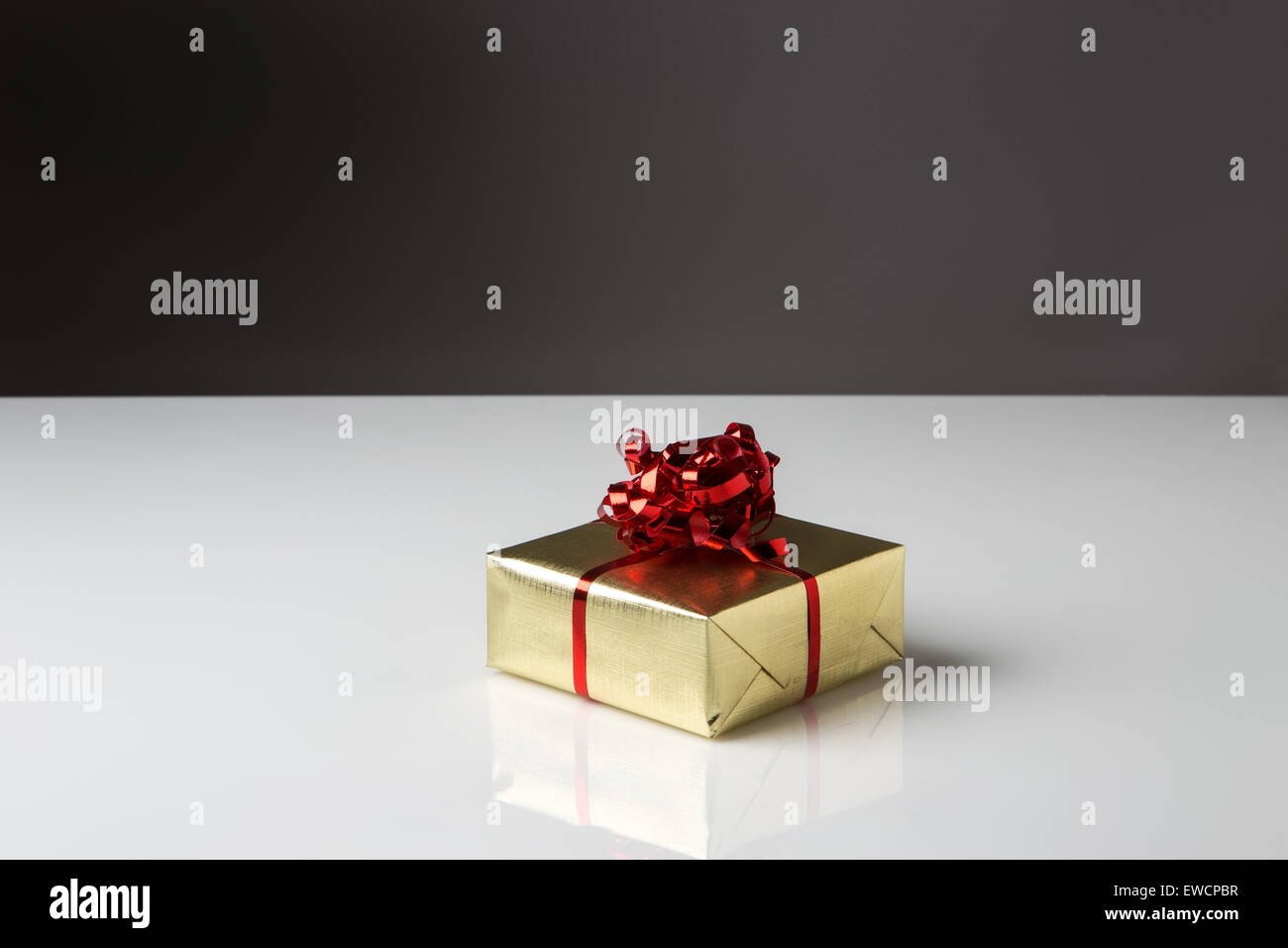 Small gift box with a ribbon around the box Stock Photo - Alamy