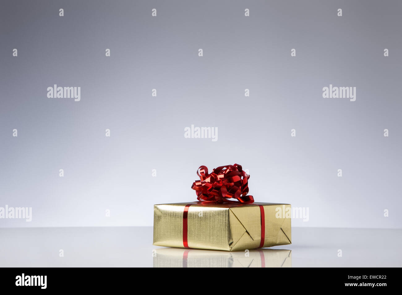 Small gift box with a ribbon around the box Stock Photo - Alamy