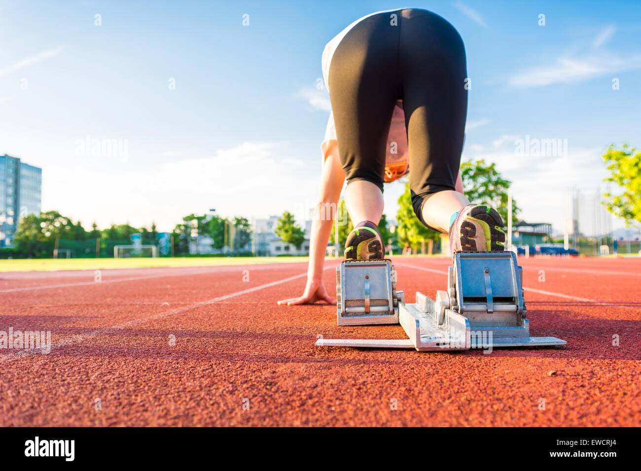 Sprinter getting ready to start Stock Photo - Alamy