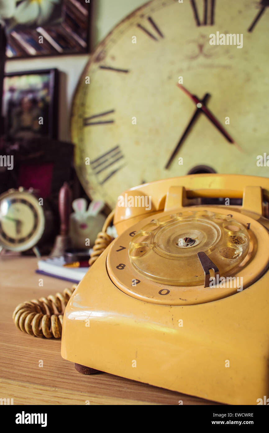 Phone old on wooden table and vintage Stock Photo - Alamy