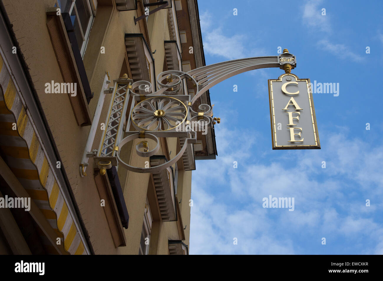 Cafe sign against blue sky Stock Photo - Alamy