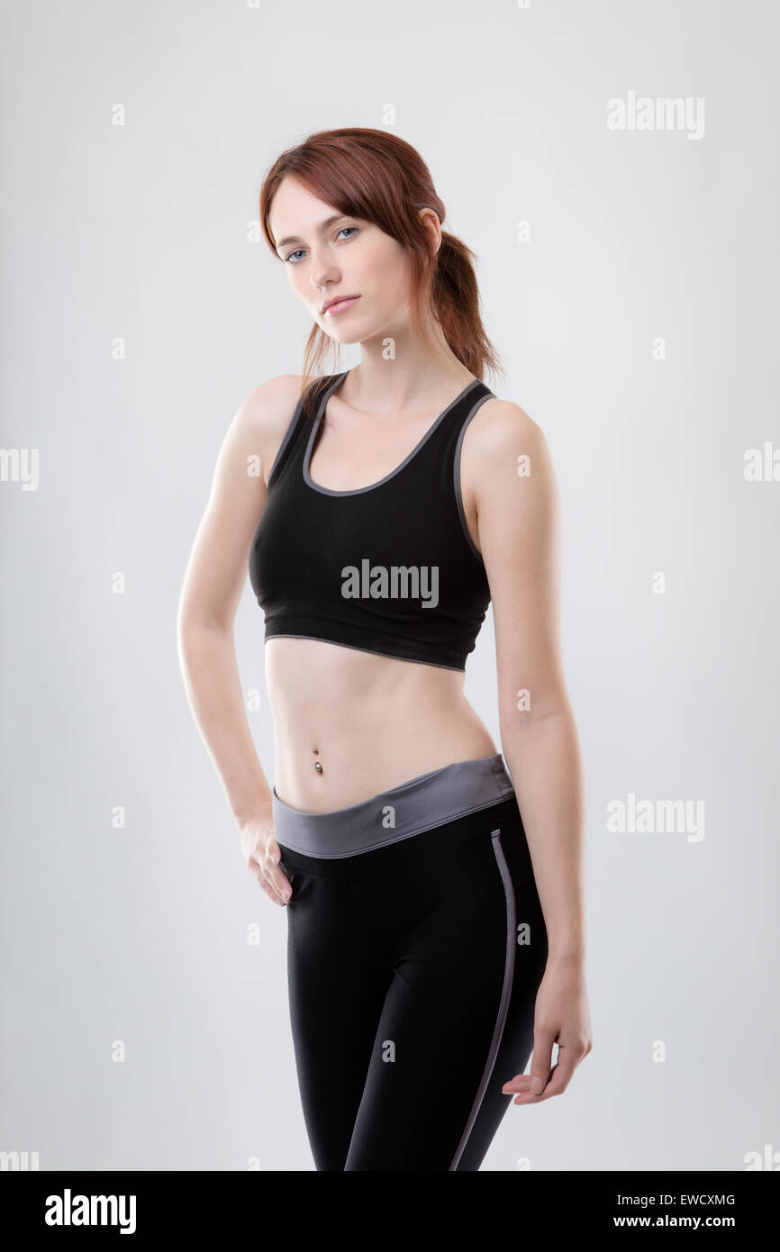 standing woman in keep fit clothes Stock Photo - Alamy