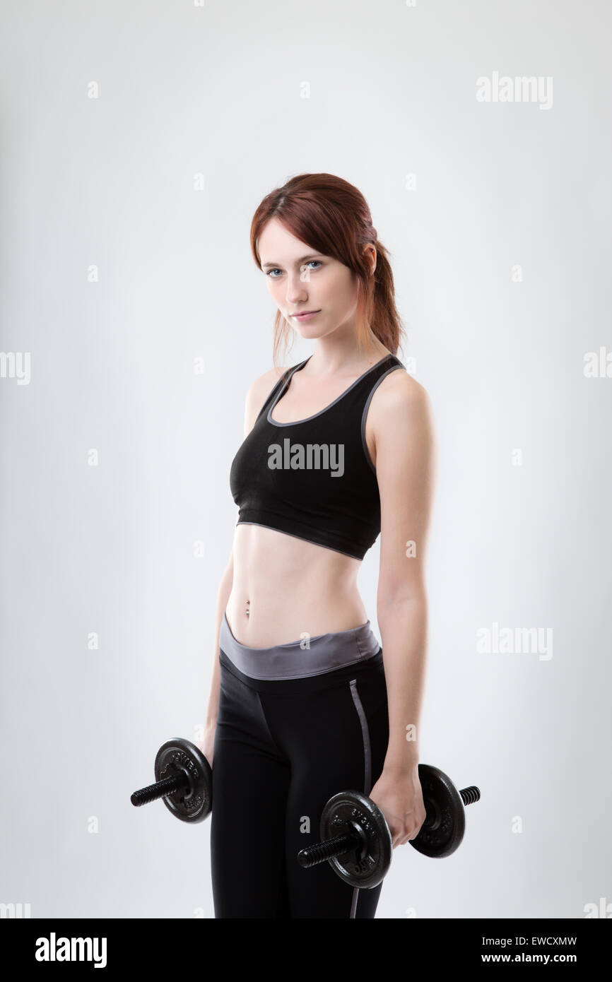 young woman working out lifting weights Stock Photo - Alamy