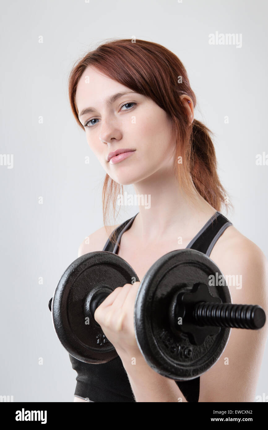 young woman working out lifting weights Stock Photo - Alamy