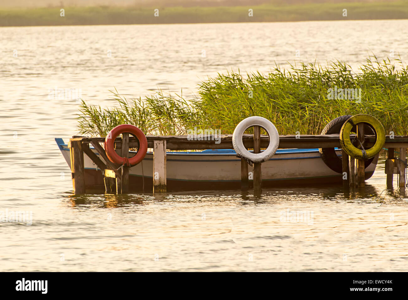 small bridge dock and ship with sunrise over lake Stock Photo - Alamy