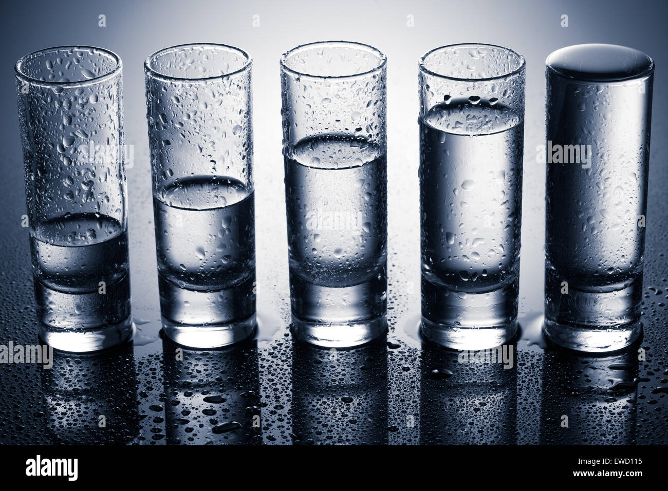 row of glasses for vodka Stock Photo - Alamy