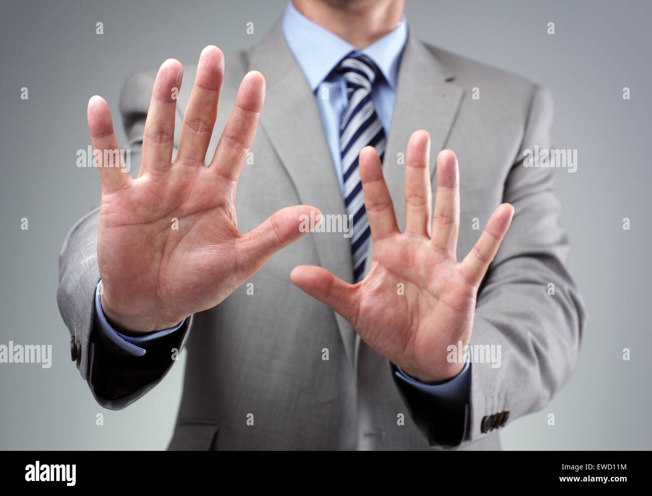 Stop or fear gesture from businessman in suit holding hands up Stock ...