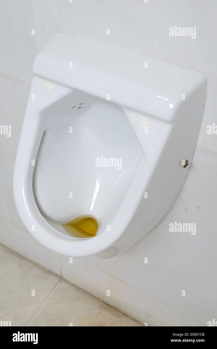 Public urinal with yellow urine Stock Photo - Alamy