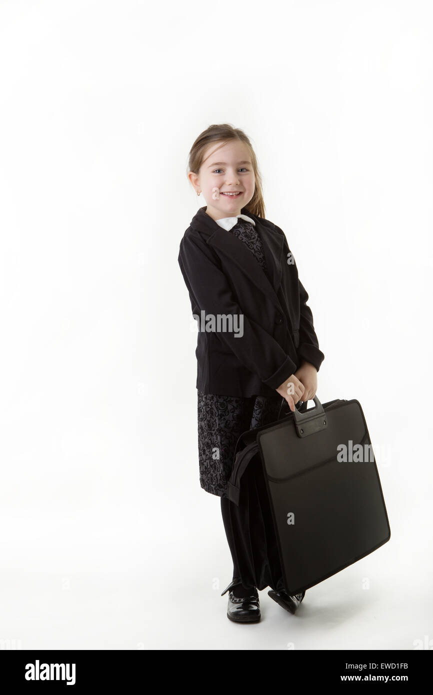 standing young girl pretending she a businesswoman holding a briefcase ...