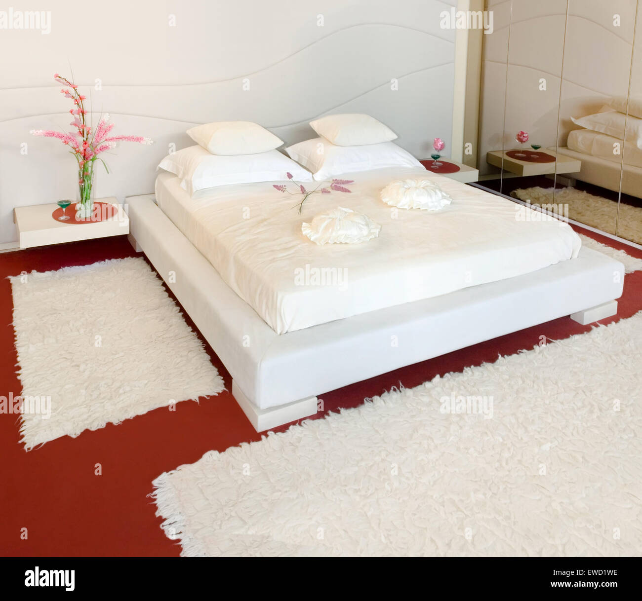 Simple Modern white bedroom interior Stock Photo - Alamy