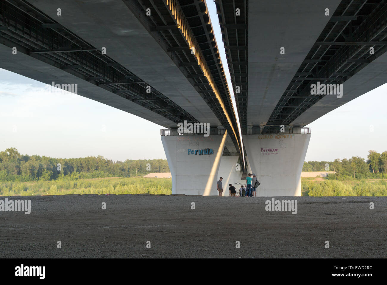 people playing under a bridge Stock Photo - Alamy