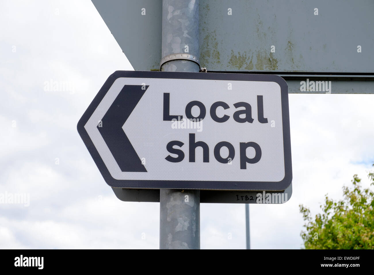 Sign directing to local shop Stock Photo - Alamy