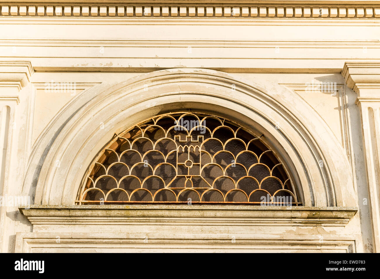 Round shapes of iron grid in a rounded window of XVII Century church ...