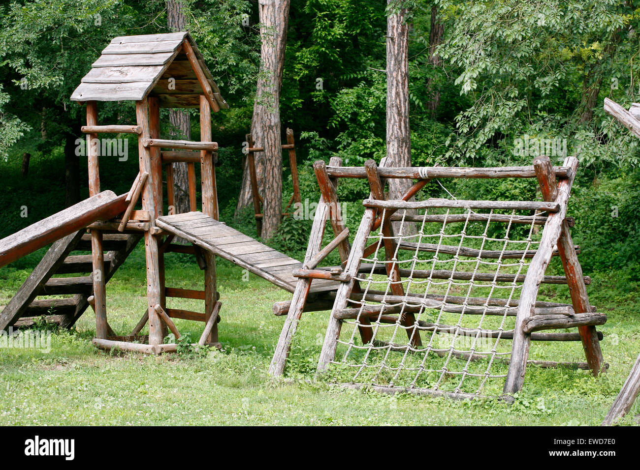 View of a wooden playground in the forest Stock Photo - Alamy