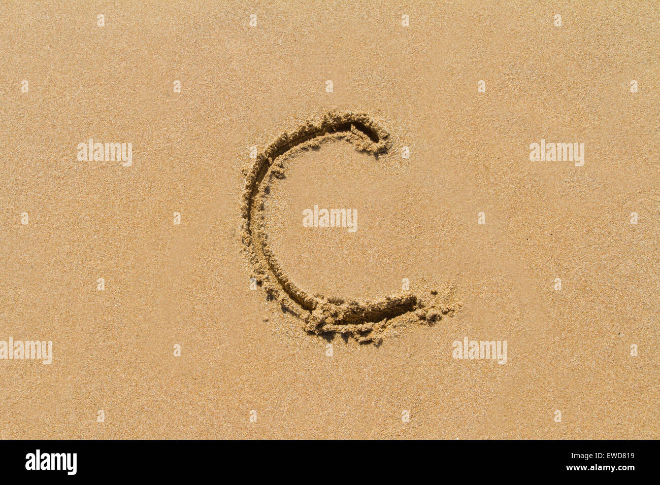 Letter C of the alphabet written on sand with upper case Stock Photo ...
