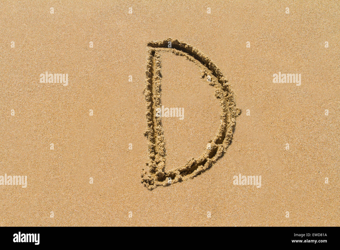 Letter D of the alphabet written on sand with upper case Stock Photo ...