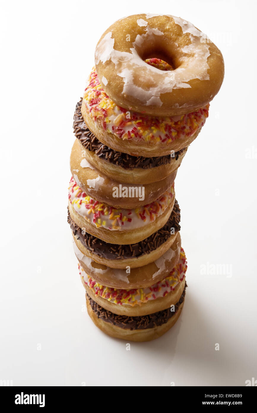 large stack of donuts on white background Stock Photo - Alamy