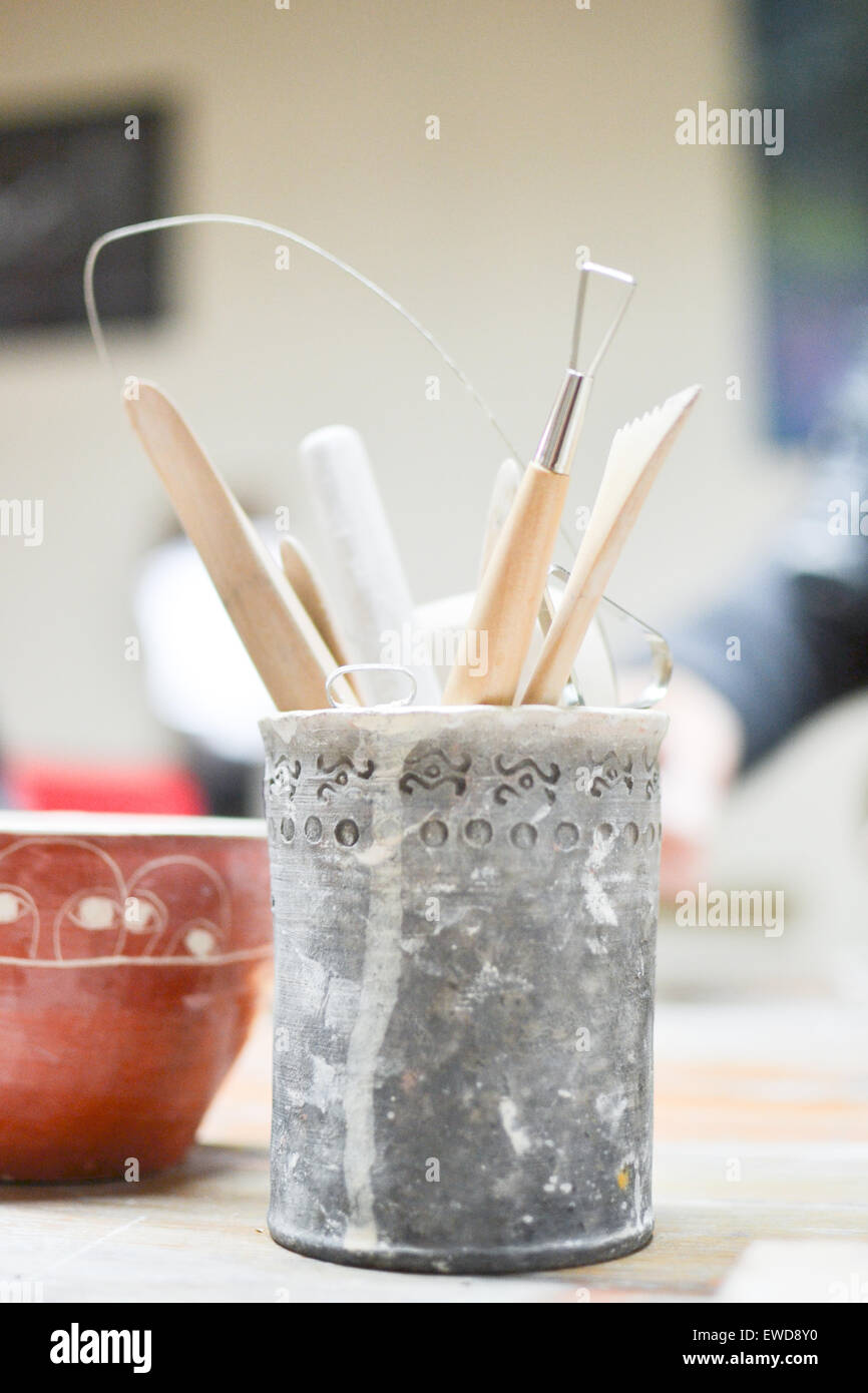 Pottery tools in a pot Stock Photo - Alamy