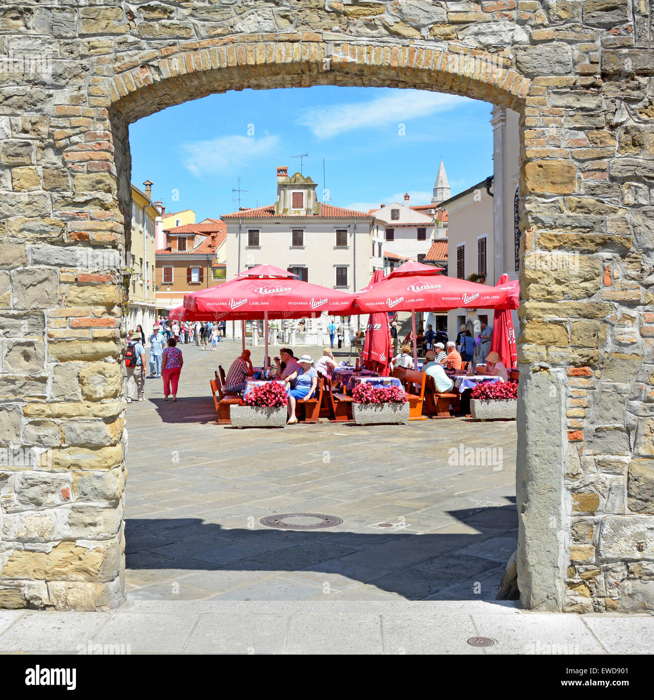 Koper Slovenia with tourists and locals at outdoor café tables viewed ...