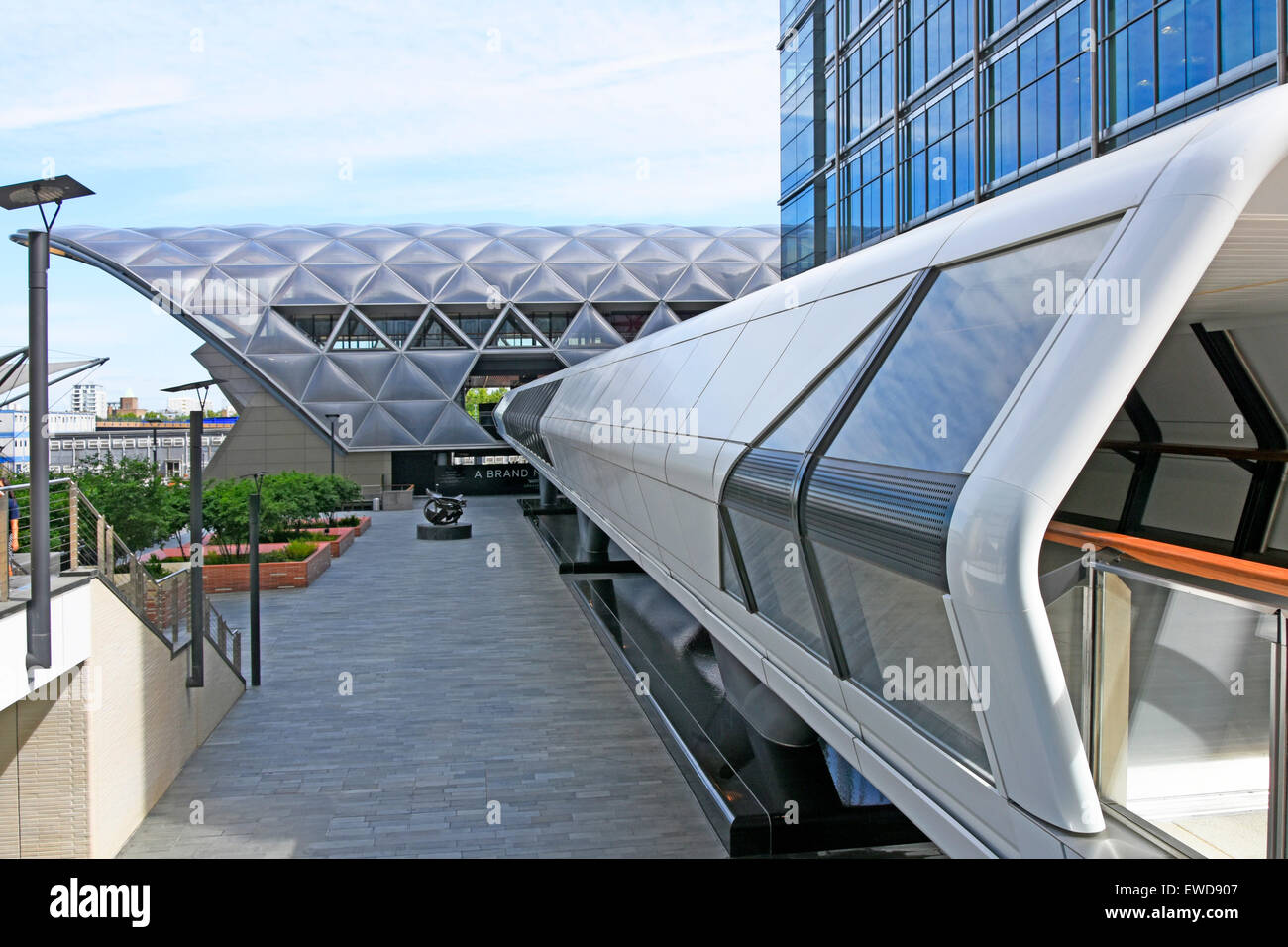 Modern building including covered footbridge linking to new Crossrail ...